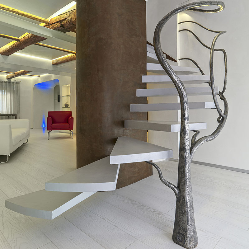 A Tree-Like Sculpture Acts As A Railing For These Stairs