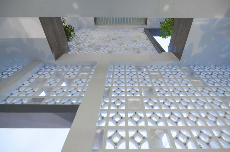 A Modern Row House Stands Out From The Crowd By Using White Concrete Blocks