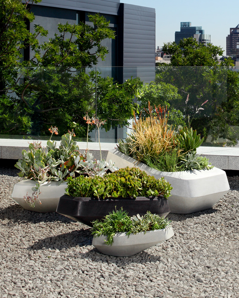 The design of these planters was inspired by jutting granite boulders ...