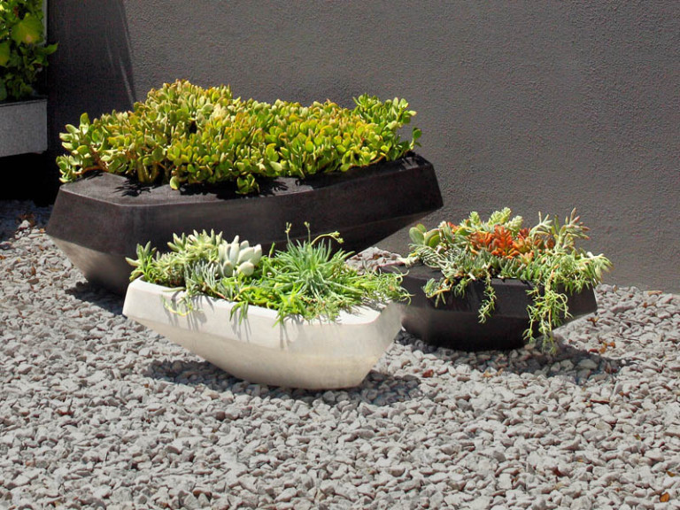 The design of these planters was inspired by jutting granite boulders ...