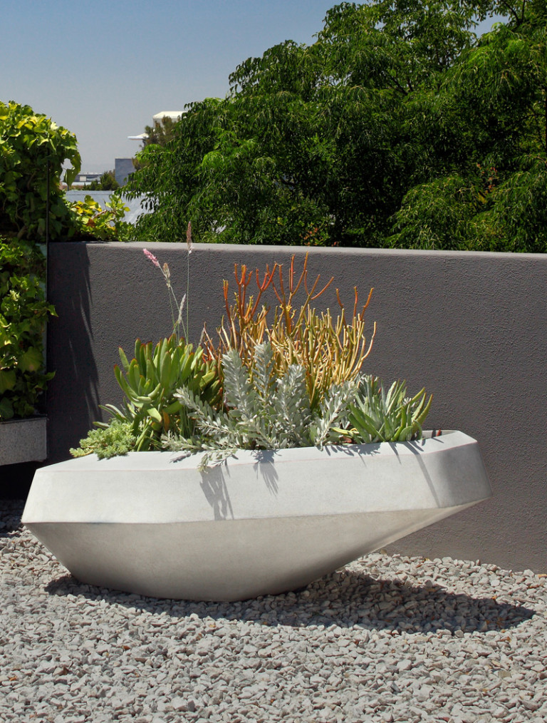 The design of these planters was inspired by jutting granite boulders ...