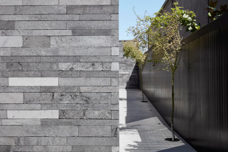 This new home is covered in lava stone inside and out