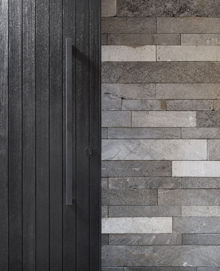 This new home is covered in lava stone inside and out