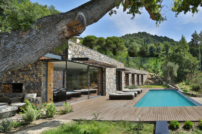 This stone covered home is nestled into an Italian hillside