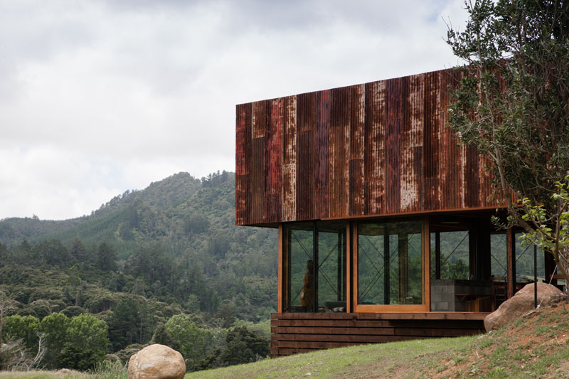 This hillside home goes for the rusty and rustic look in a big way