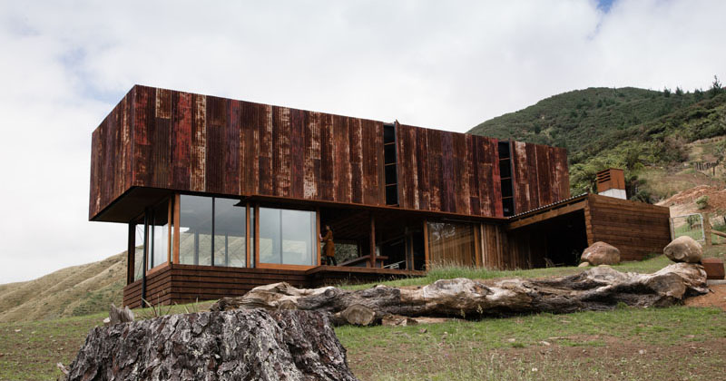 This hillside home goes for the rusty and rustic look in a big way