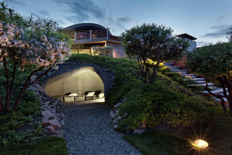 This house with a wavy roof was designed to merge with nature