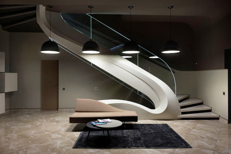 This house with a wavy roof was designed to merge with nature