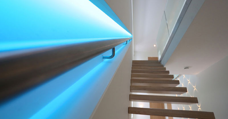 A color changing handrail adds some drama to this staircase