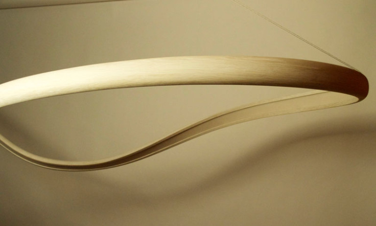 This continuous loop of bent wood emits light from embedded LEDs
