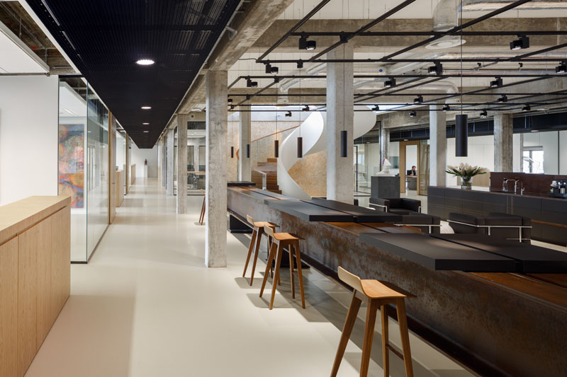 A huge I-Beam was taken from a bridge and included in this office design
