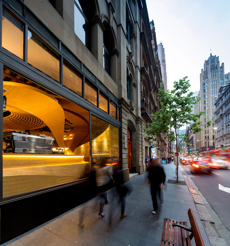 This new cafe is filled with a sculptural wood feature inspired by ...