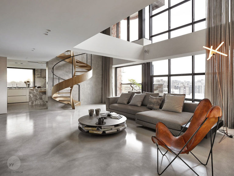 A Sculptural Spiral Staircase Makes A Statement In This Home's Interior