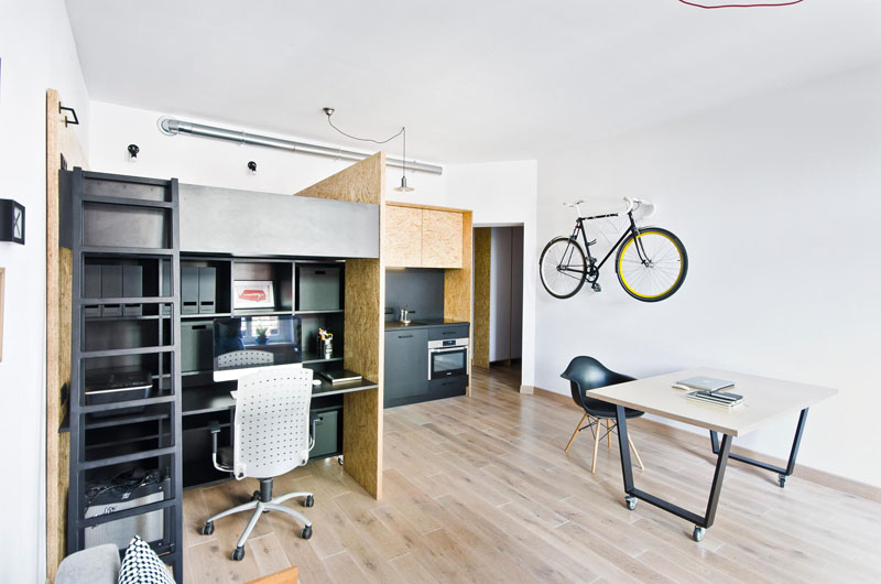 This small apartment has been designed as a live/work space for a ...