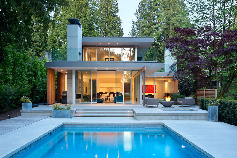 This new modern house in Vancouver is surrounded by tall evergreen trees
