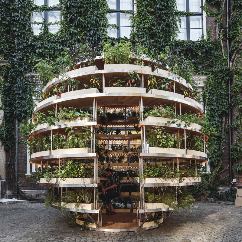 This public pavilion covered in plants was designed to invite people to ...