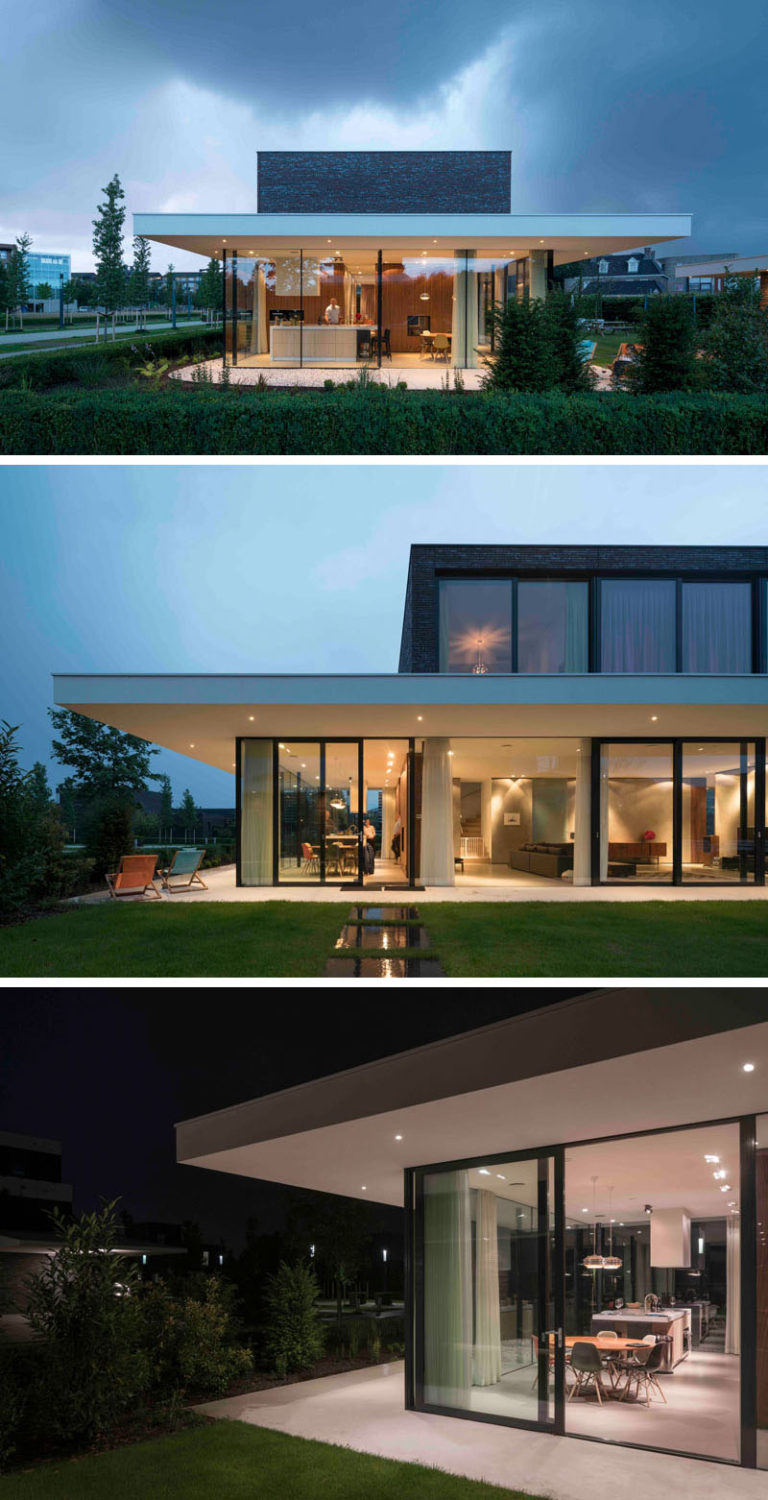 The ground floor of this house is almost completely surrounded by windows