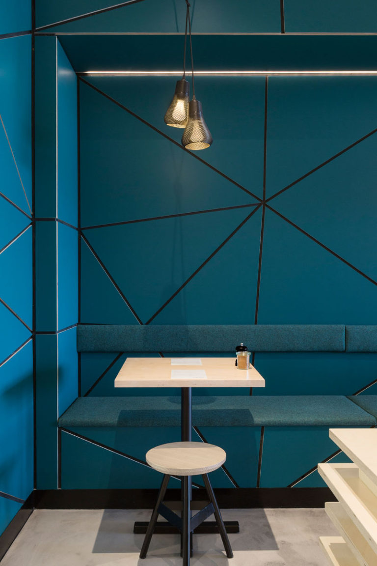 The interior of this cafe is covered in geometric panel shapes