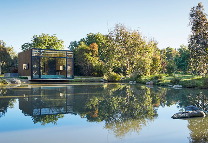 This small building next to a pond was designed to be used as a yoga ...