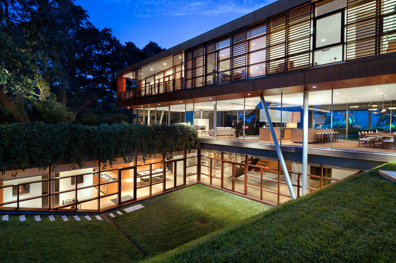 This contemporary house was designed with a floating box above a ...