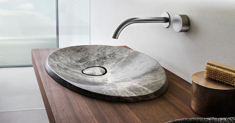 The design of this natural stone sink is inspired by the shape of ...