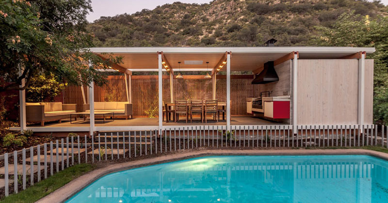 This modern backyard pool house is designed for entertaining
