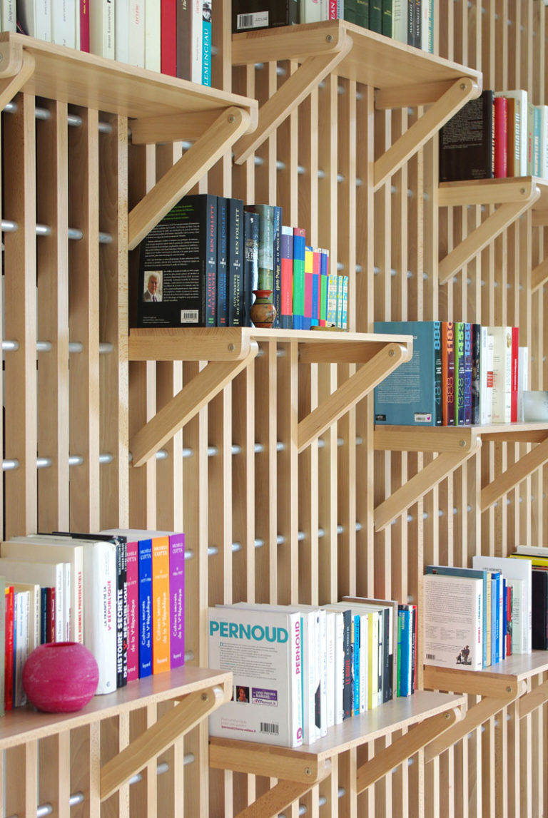 This Custom Designed Shelf System Is Used To Store Books And Act As A ...