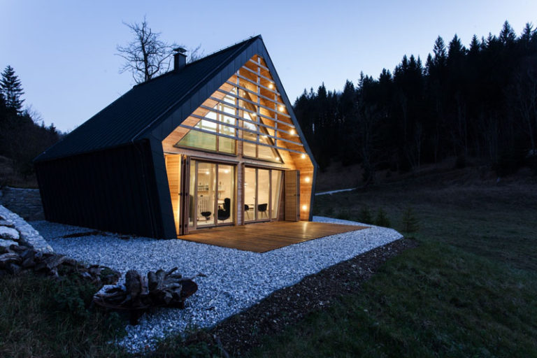 The Dark Exterior Of This Wood House Encloses A Light Interior
