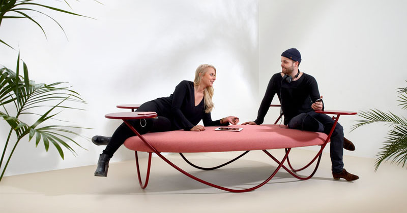 This Seating Designed For Multiple People Has Tables With Ports For ...