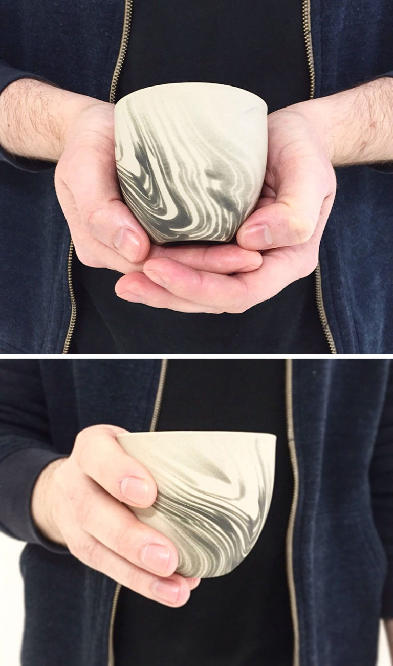 A Collection Of Espresso Cups Designed With Unique Decorative Swirls