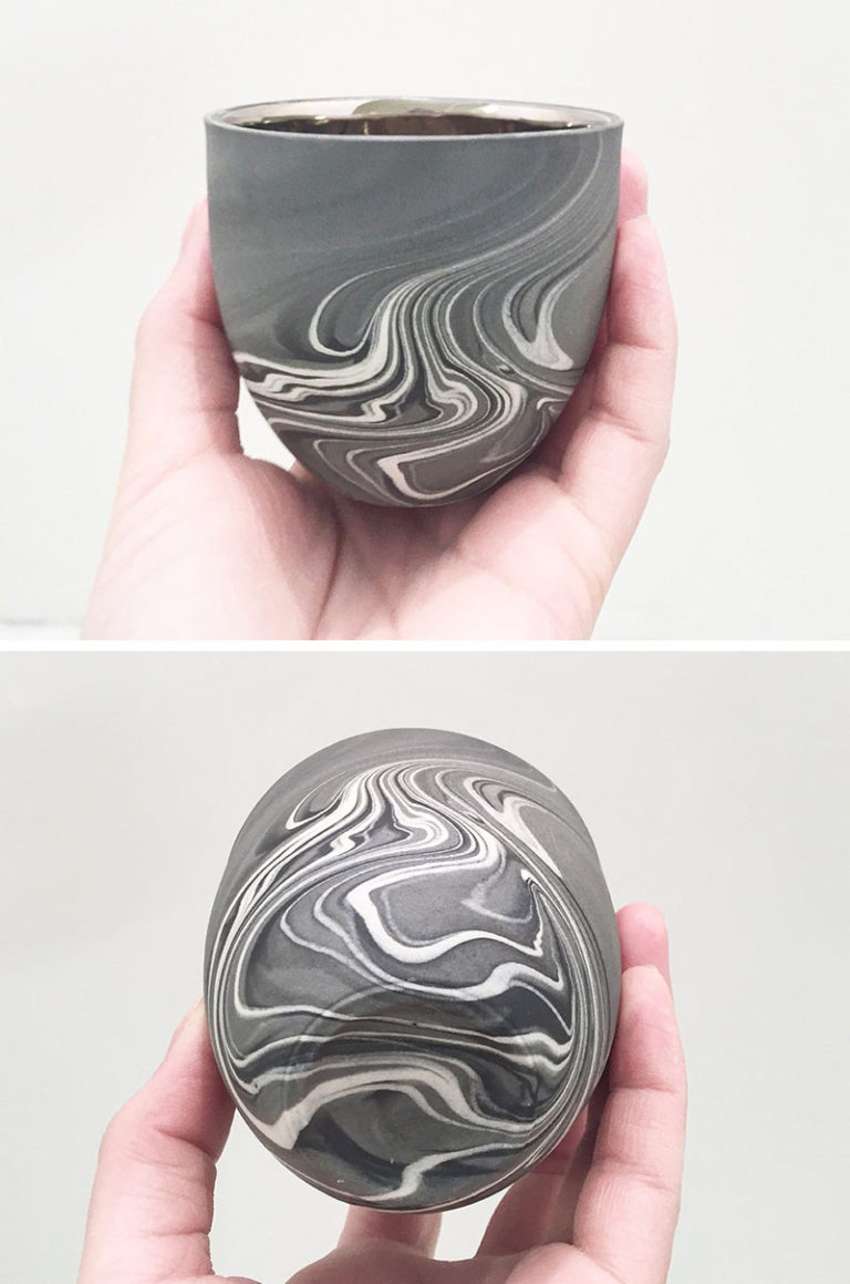 A Collection Of Espresso Cups Designed With Unique Decorative Swirls