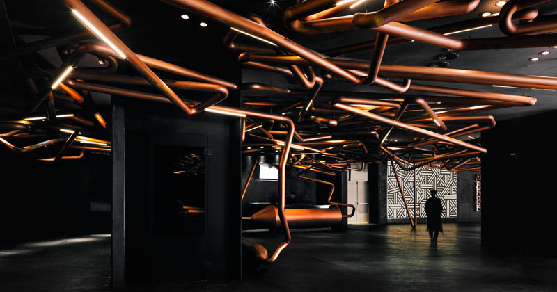 Tangled Copper Pipes Run Throughout This Cinema