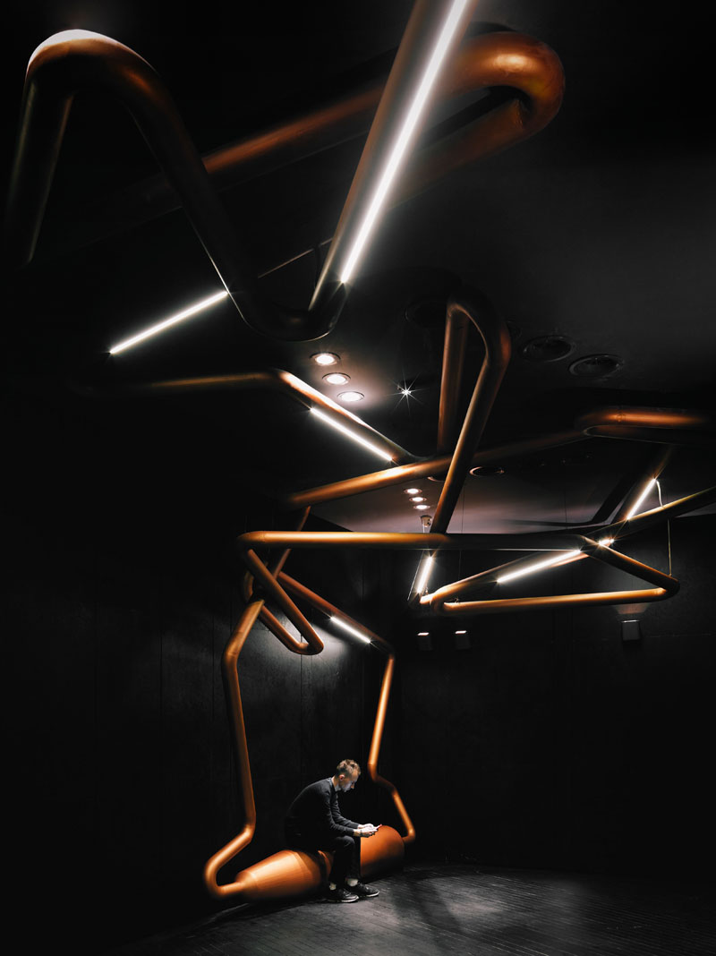 Tangled Copper Pipes Run Throughout This Cinema