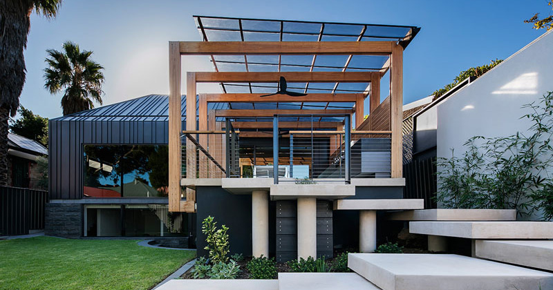 This House Extension Has A Modern Pergola That Leads To A Swimming Pool