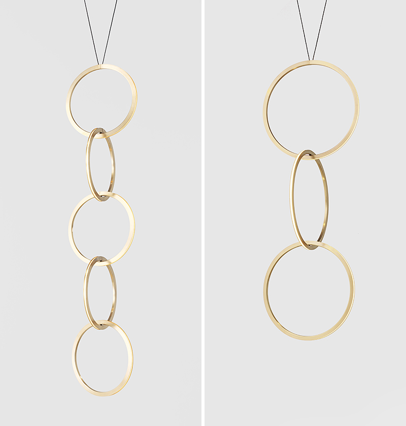 This Vertical Pendant Light Is Made Using Brass Rings