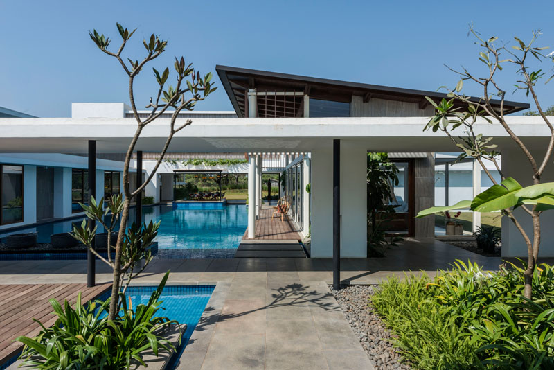 This House Was Designed To Wrap Around A Large Swimming Pool