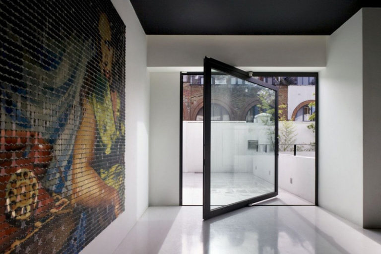 11 Pivoting Glass Doors That Make A Statement And Let Natural Light In