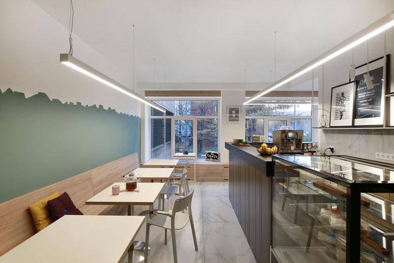 This Cafe Features Turquoise Painted Walls With An Uneven Edge