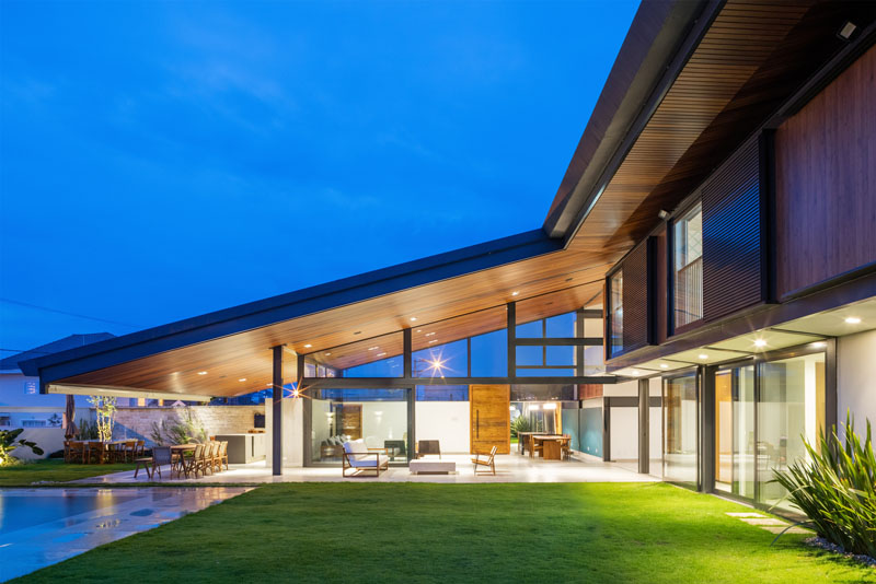 A Large Sloping Roof Is A Prominent Feature Of This New House In Brazil