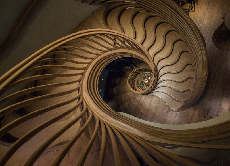 16 Photos Of An Amazingly Sculptural Wood Staircase Inside A Restaurant