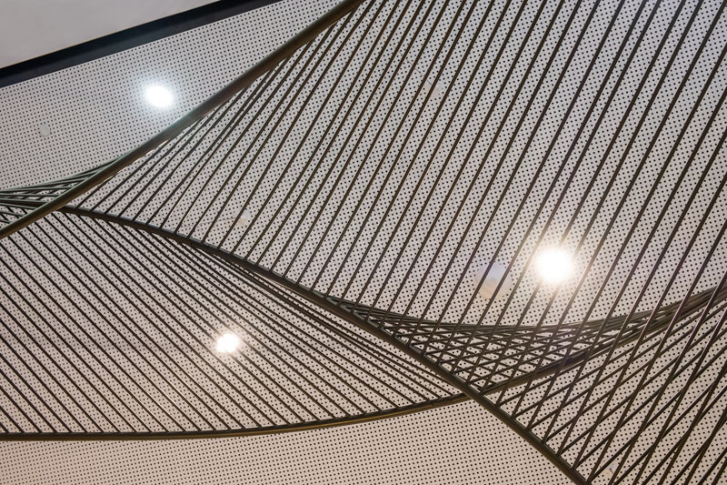 Two Suspended Sculptures Hang In The Lobby Of A New Building In Melbourne