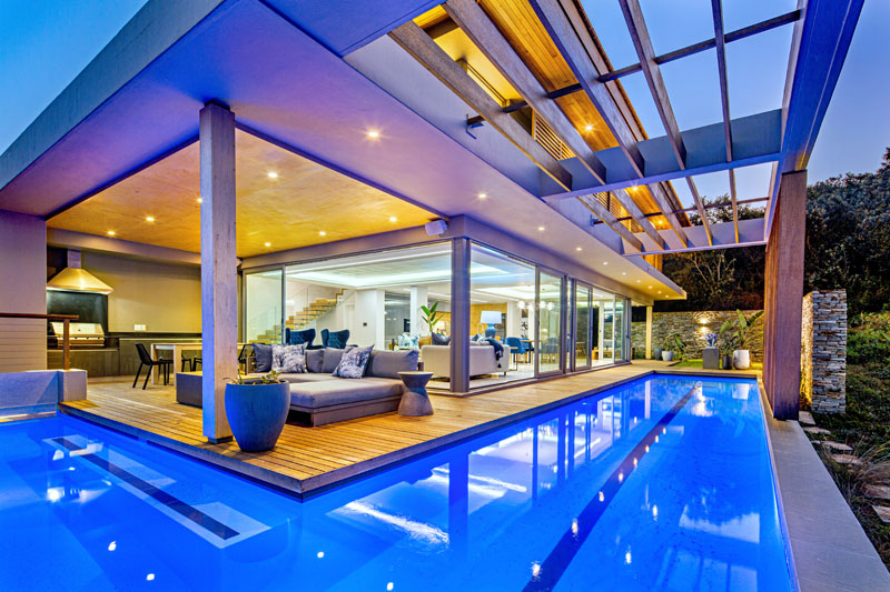 House Desai Has A Swimming Pool That Wraps Around The Ground Floor