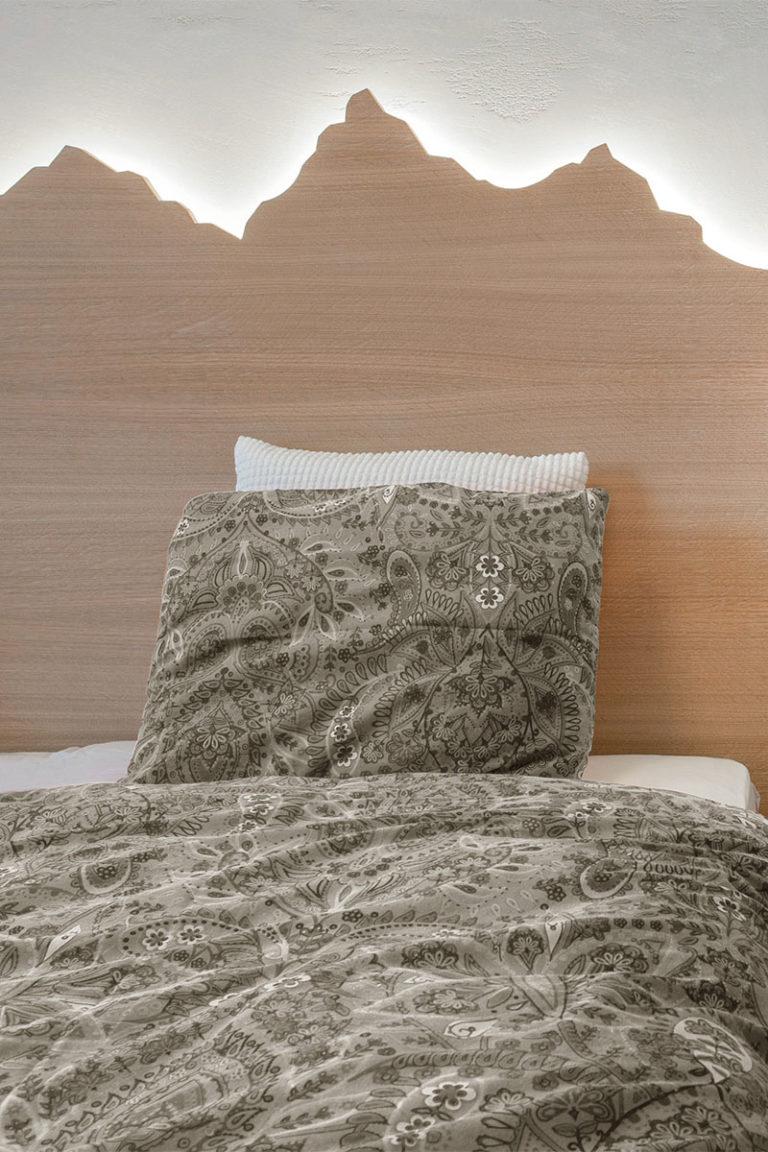 Bedroom Design Idea - A Backlit Headboard Showcases A Mountain Range