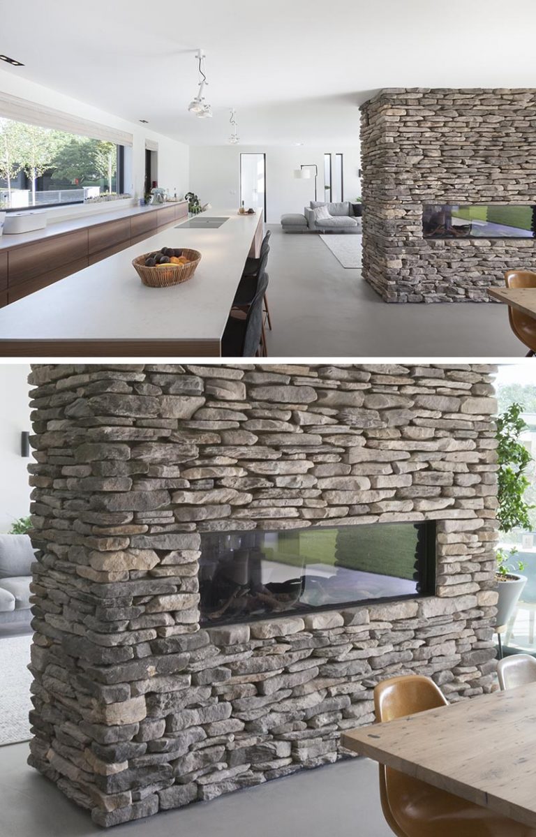 This Stone Partition Provides A Home For A Fireplace And Television