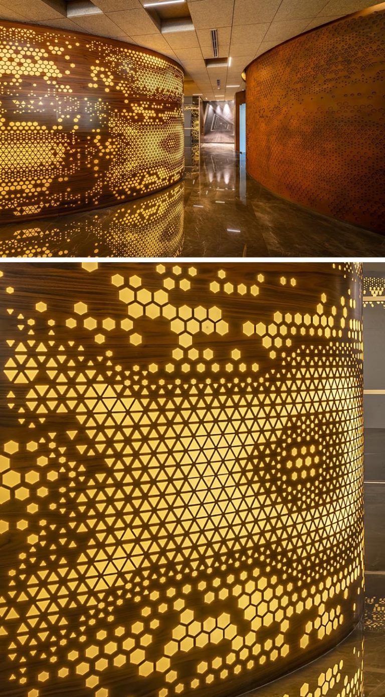 Perforated Walls Add Soft Light To This Office Environment