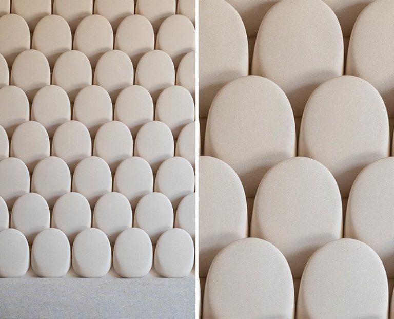 An Eye-Catching Bedroom Accent Wall Made From Rows Of Stone-Like Pieces