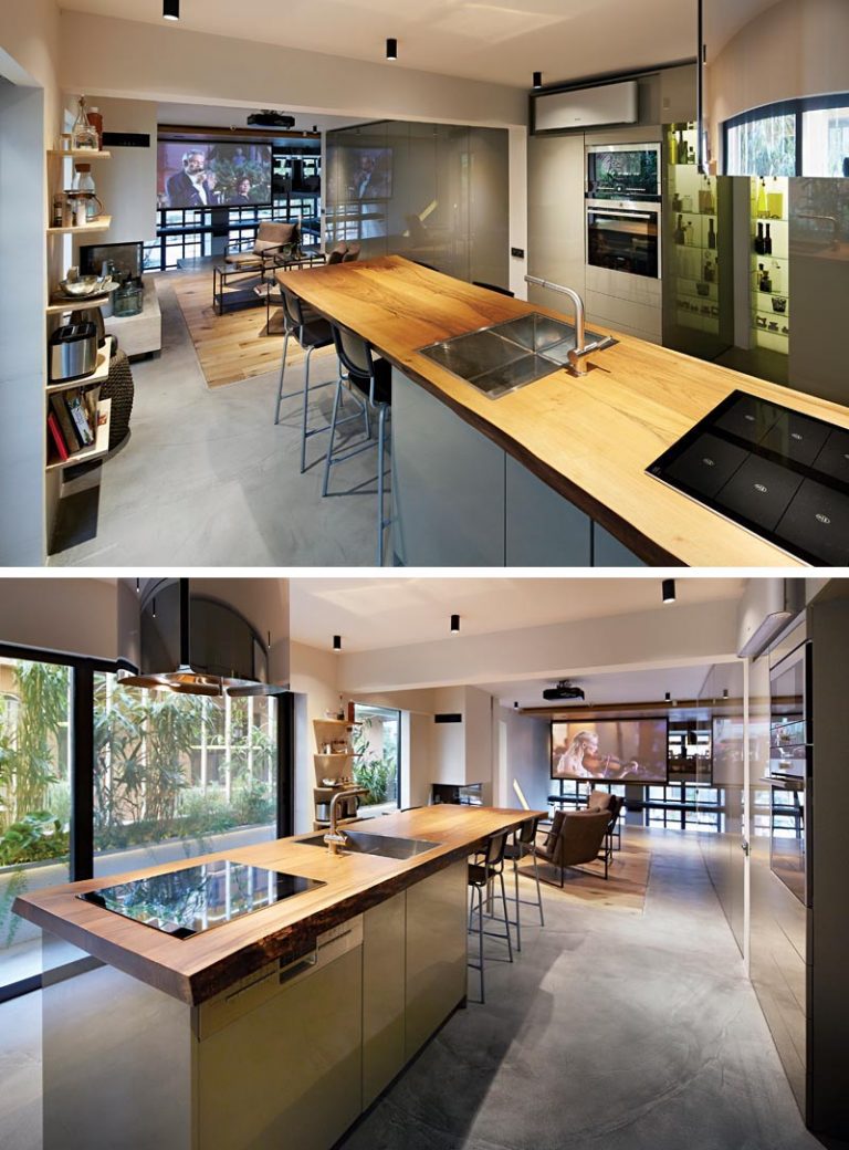 A Long Kitchen Island With A Live Edge Countertop