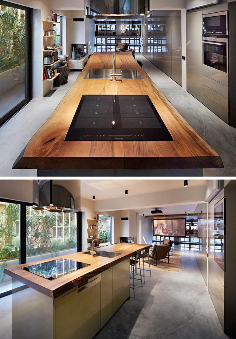 A Long Kitchen Island With A Live Edge Countertop