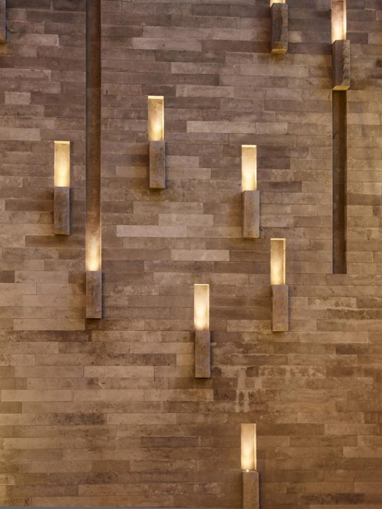 This Outdoor Fireplace Is Also A Climbing Wall