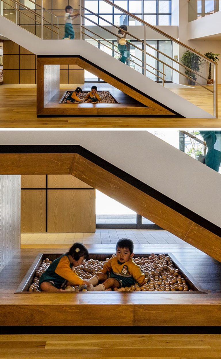 A Kids Play Area With A Ball Pit Was Designed For The Empty Space Under ...